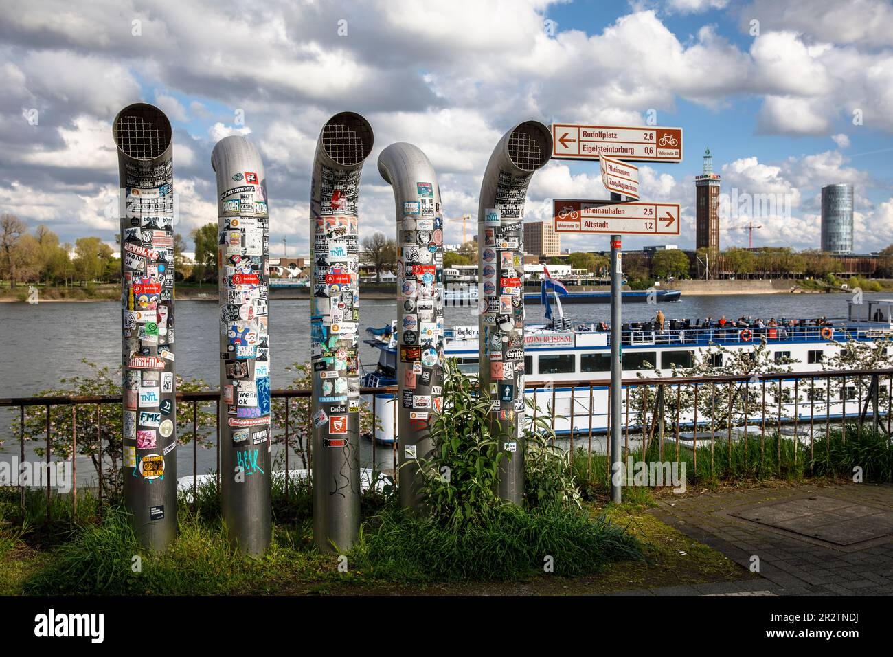 ventilation pipes on the banks of the Rhine covered with many stickers ...