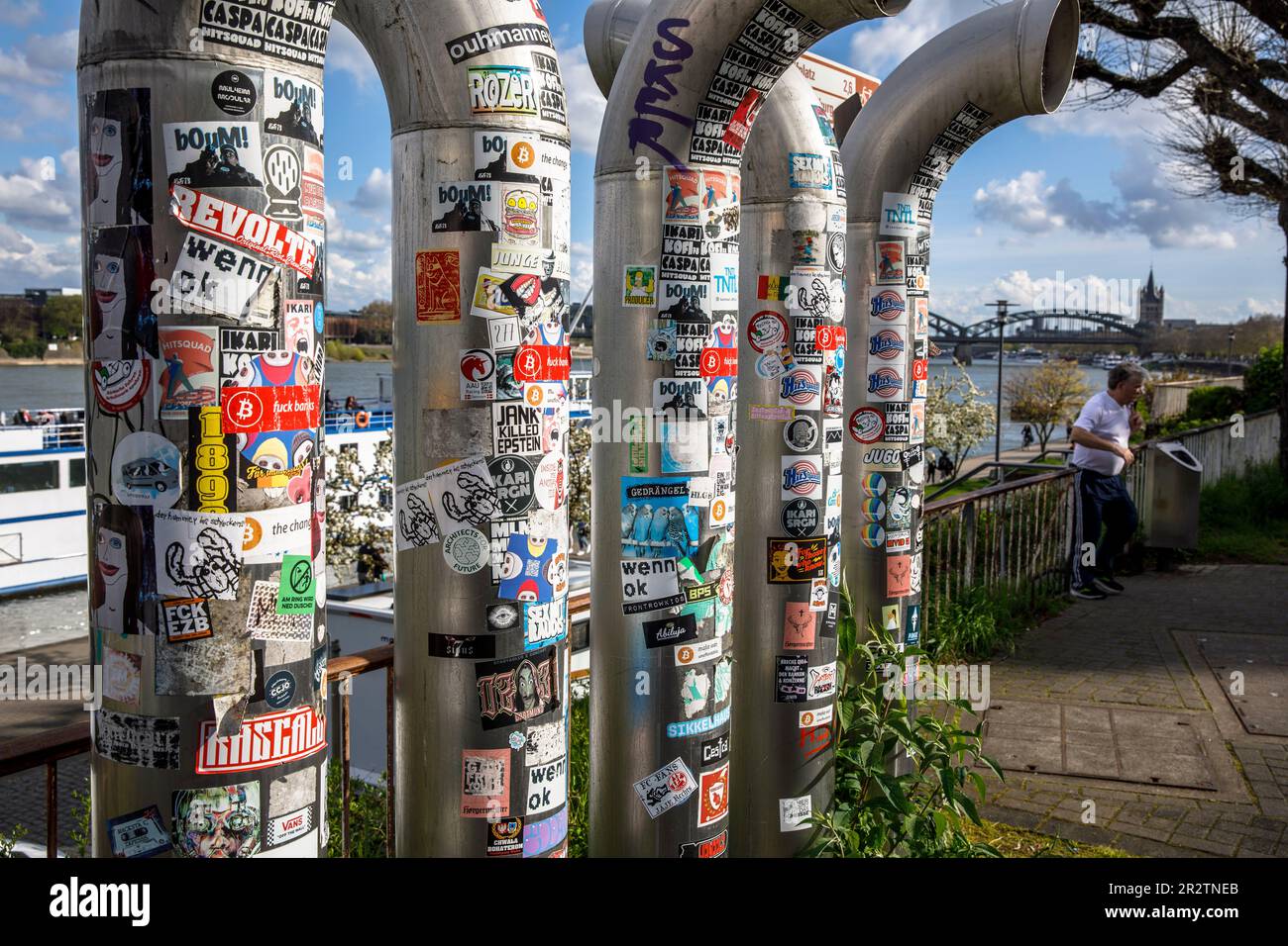ventilation pipes on the banks of the Rhine covered with many stickers ...