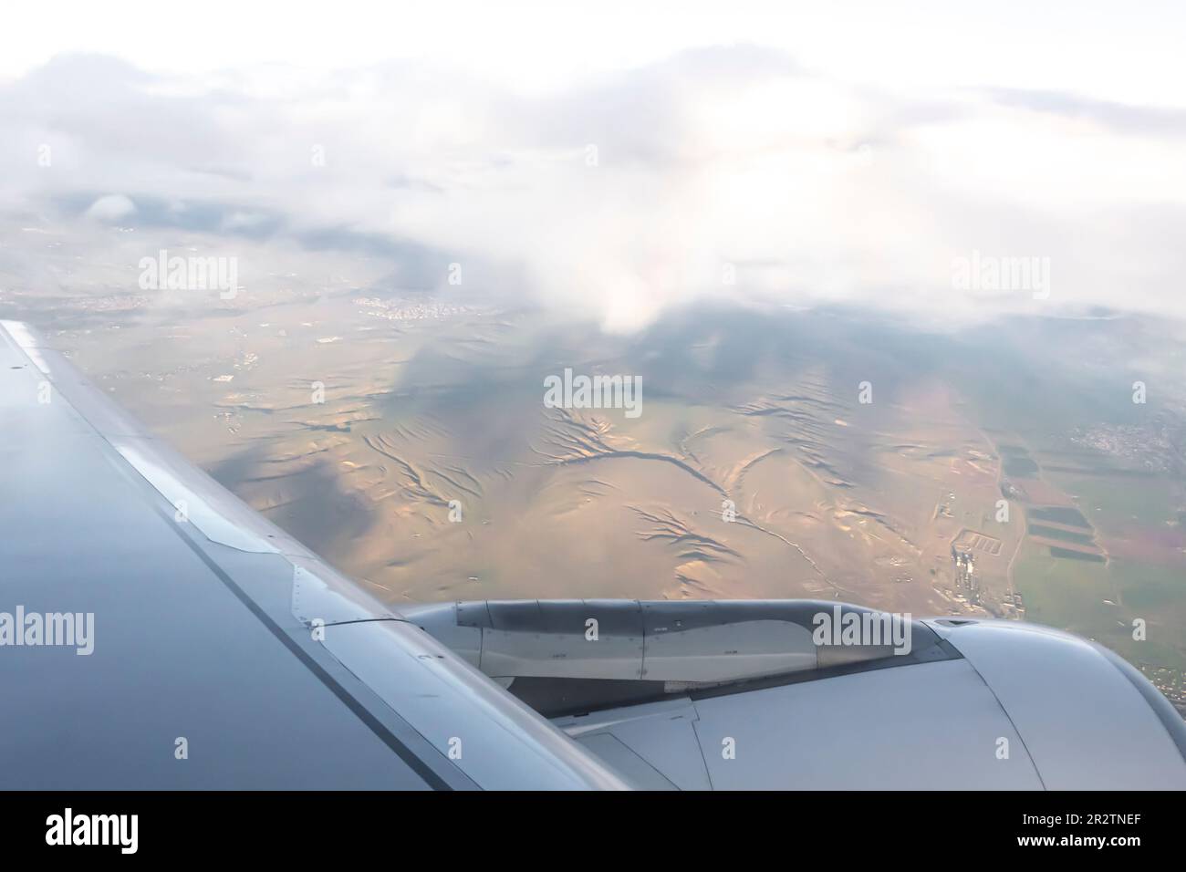 Clouds seen through the jet engine - aerial view from an airplane ...
