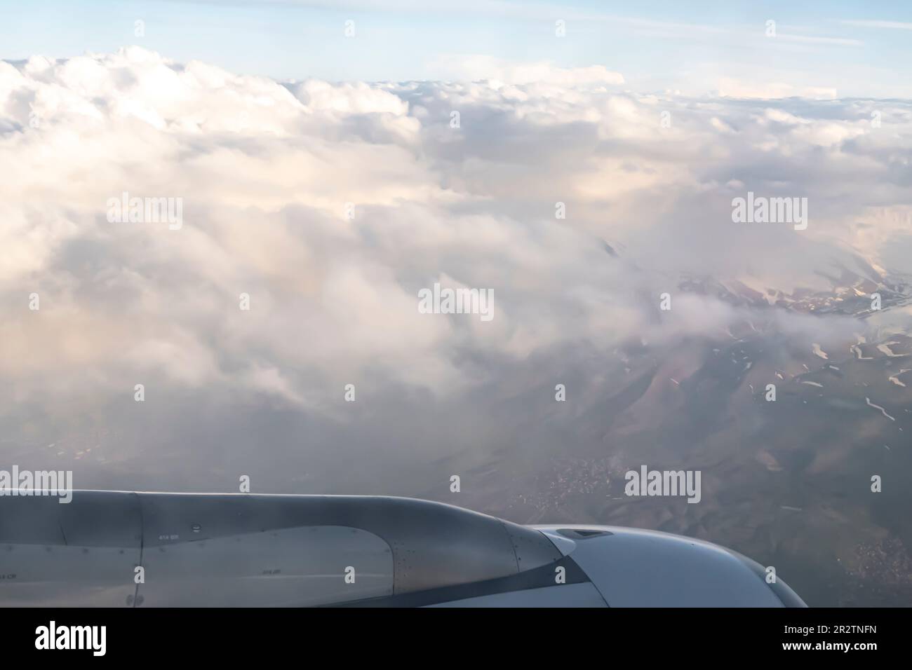 Clouds seen through the jet engine - aerial view from an airplane ...