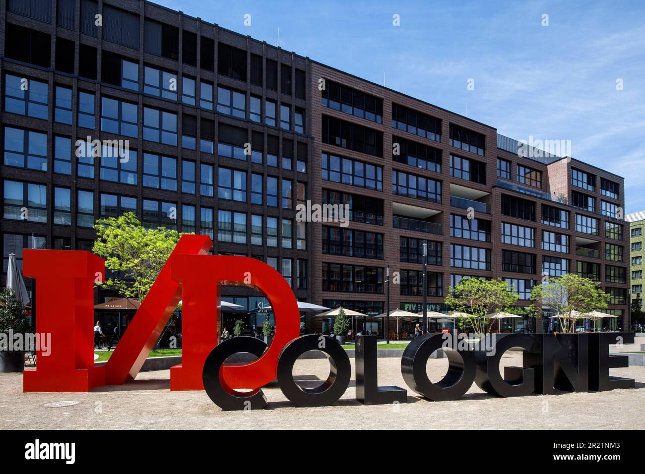 logo of the town quarter I/D Cologne in front of the buildings Haus am ...