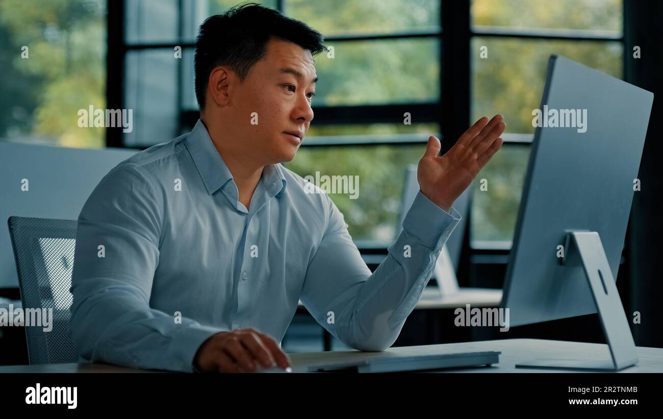 Chinese middle-aged businessman work on computer receive bad email ...
