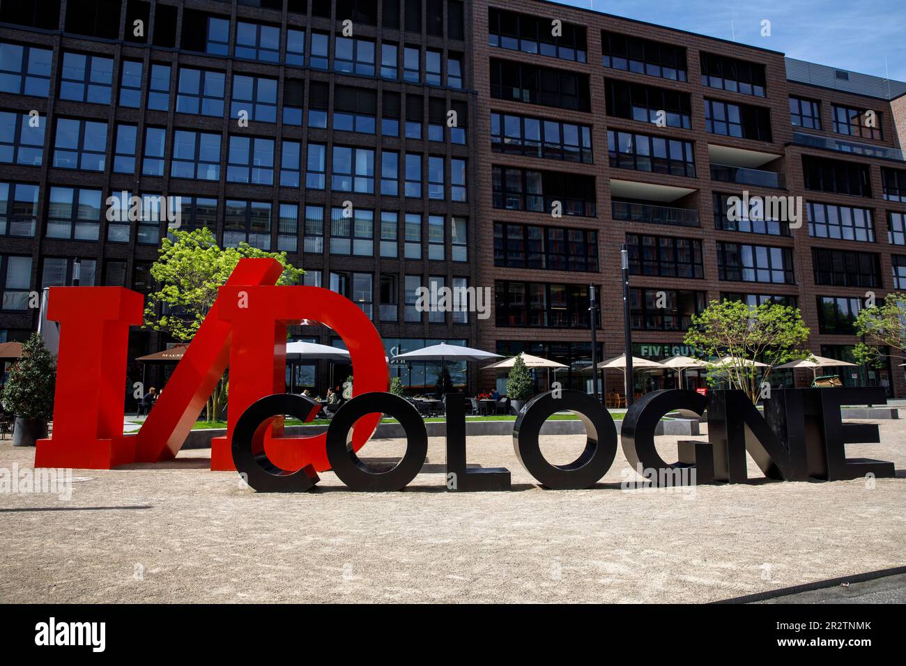 logo of the town quarter I/D Cologne in front of the buildings Haus am ...