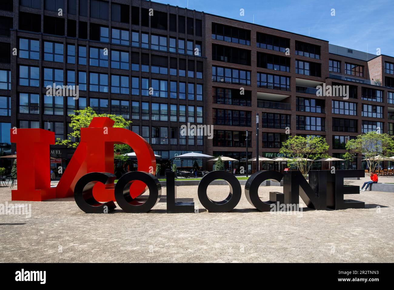 logo of the town quarter I/D Cologne in front of the buildings Haus am ...