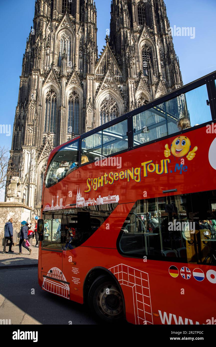 sightseeing bus in front of the cathedral, Cologne, Germany ...