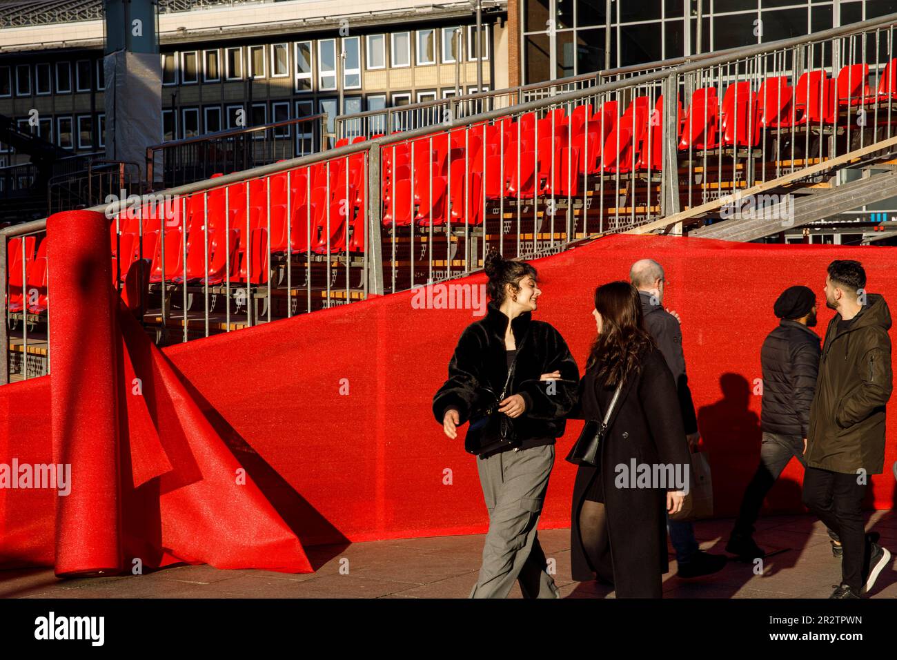 people passing a red grandstand set up for the carnival processions in ...
