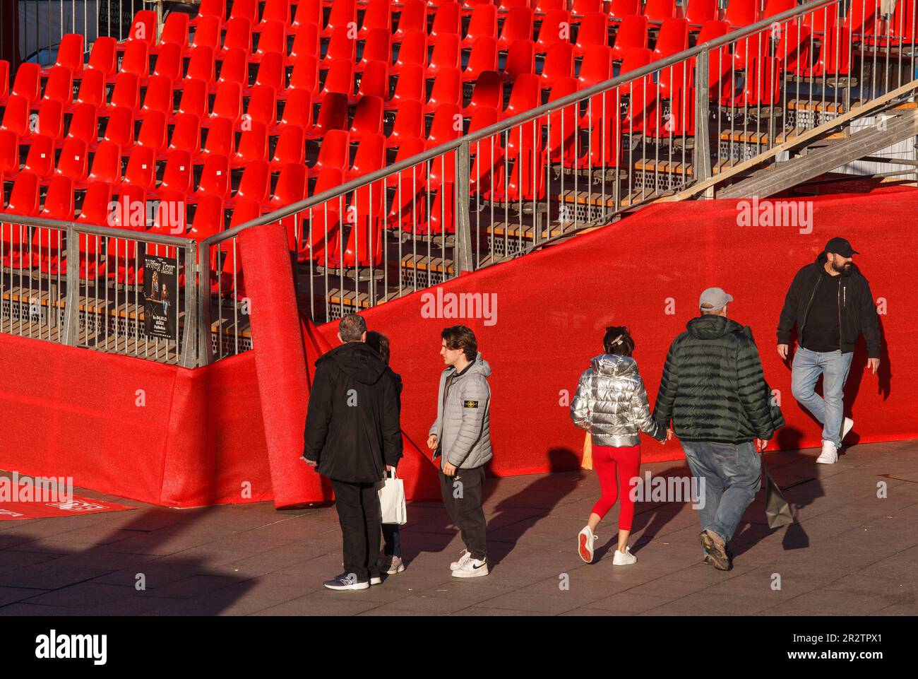 people passing a red grandstand set up for the carnival processions in ...