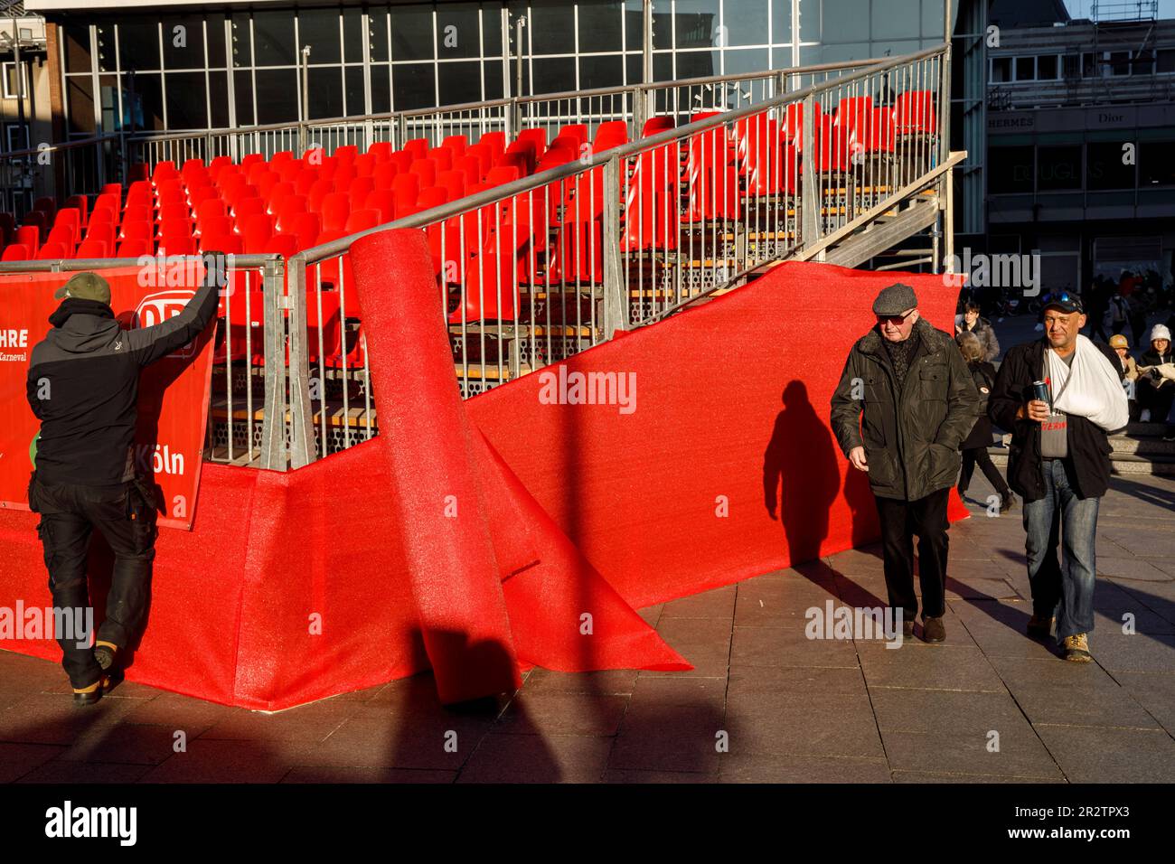 people passing a red grandstand set up for the carnival processions in ...
