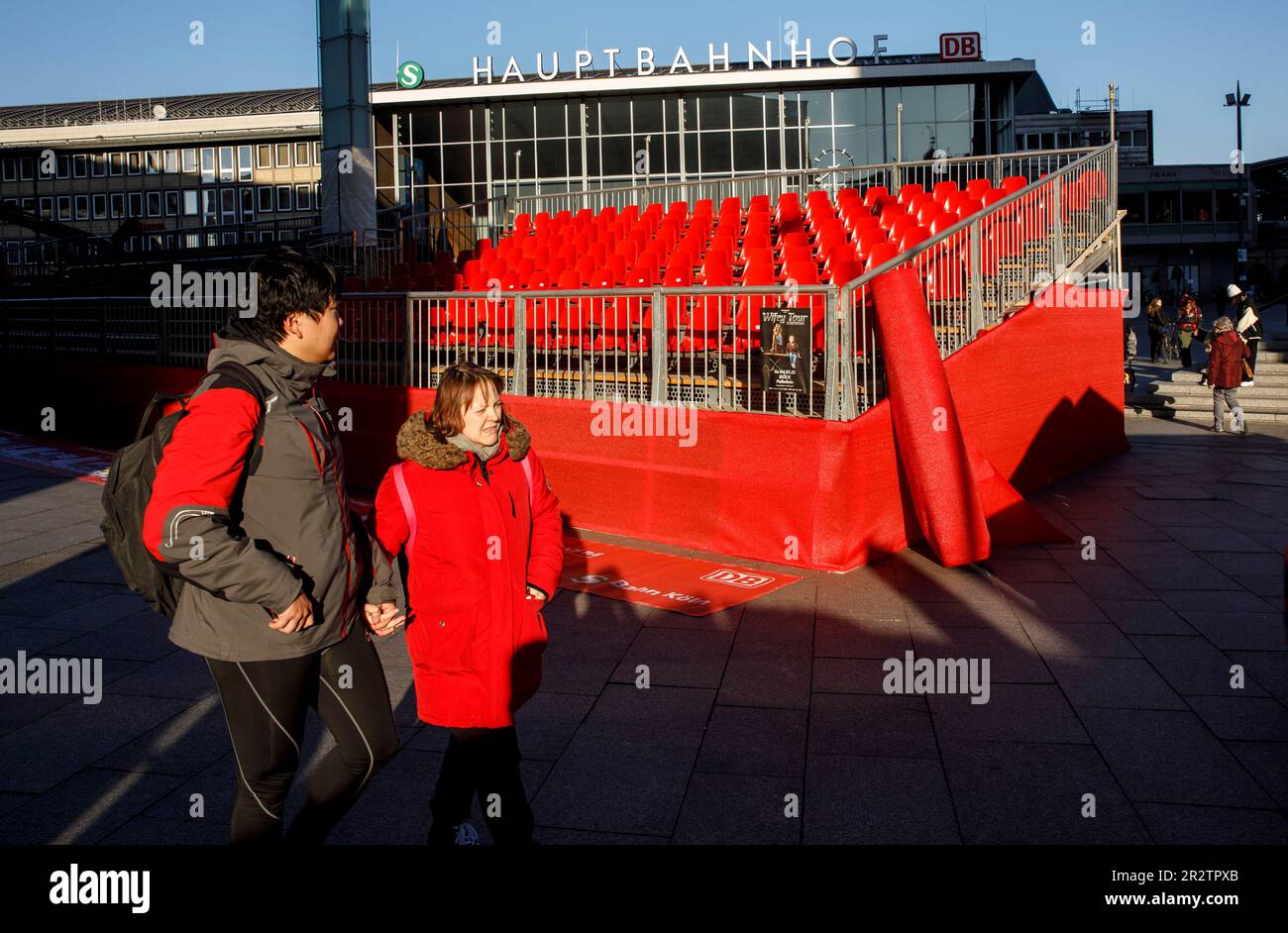 people passing a red grandstand set up for the carnival processions in ...
