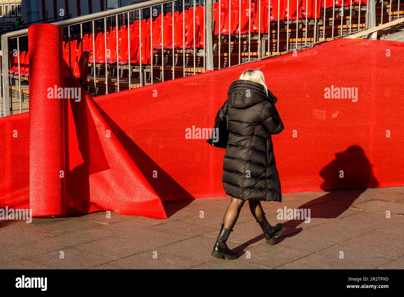 people passing a red grandstand set up for the carnival processions in ...