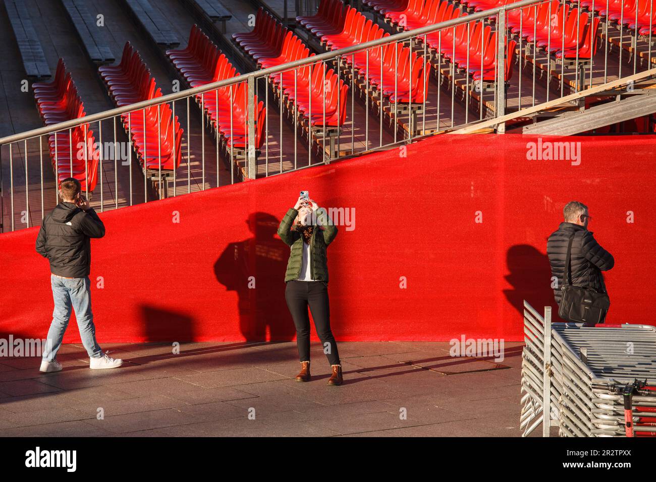 people passing a red grandstand set up for the carnival processions in ...