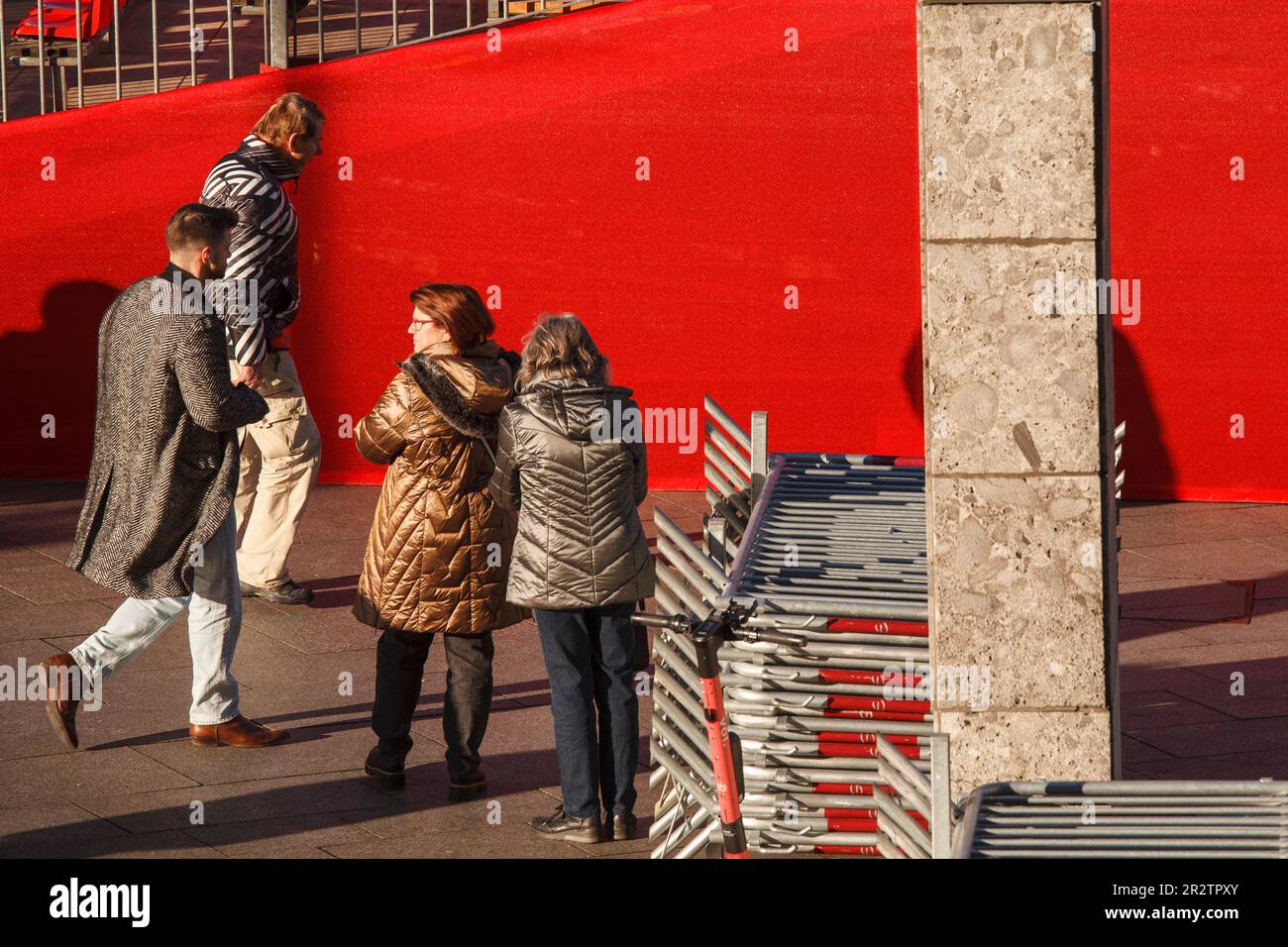 people passing a red grandstand set up for the carnival processions in ...