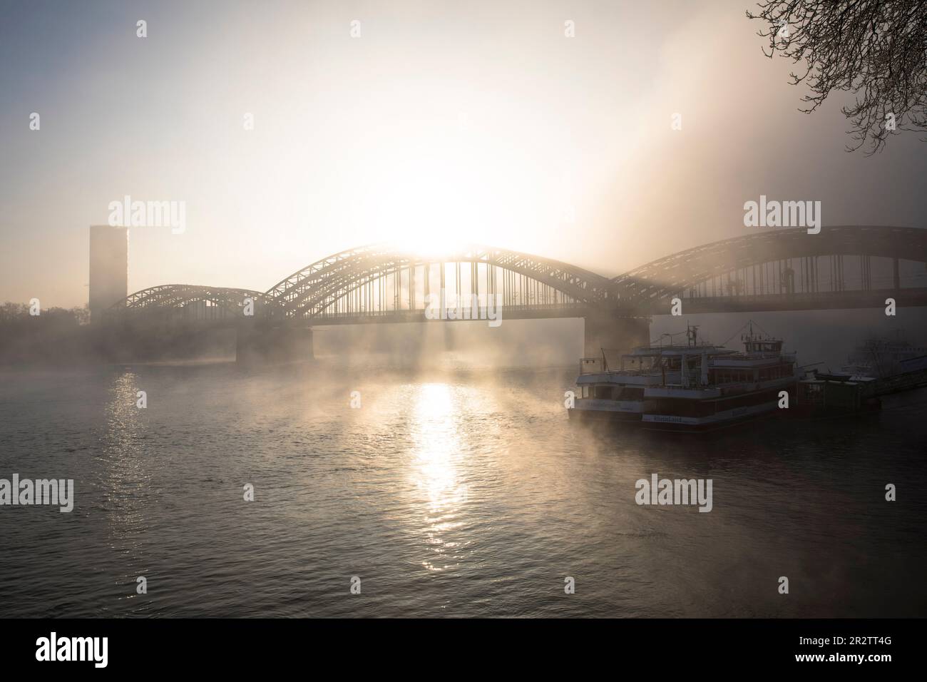 the Hohenzollern bridge over the river Rhine in fog, view to ...