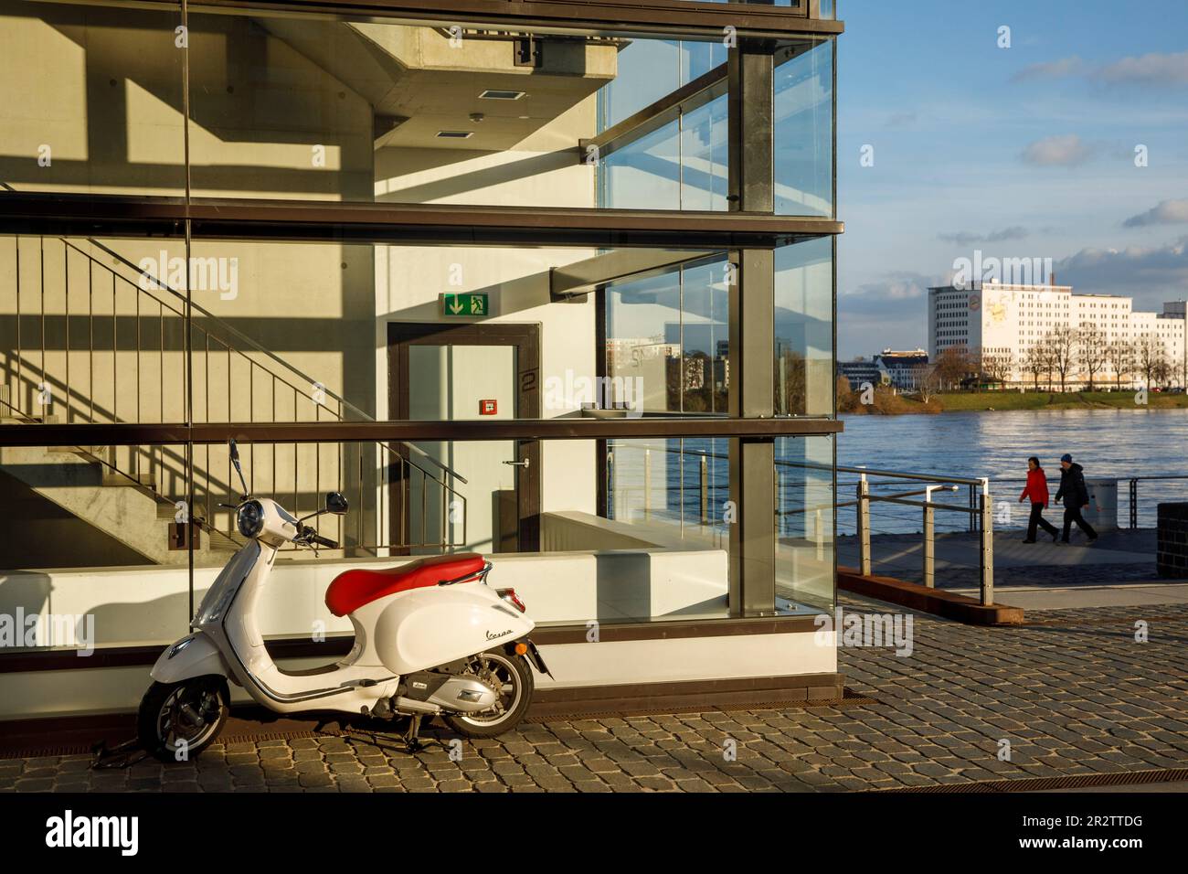 a Vespa scooter stands in front of the glazed staircase of a Crane ...