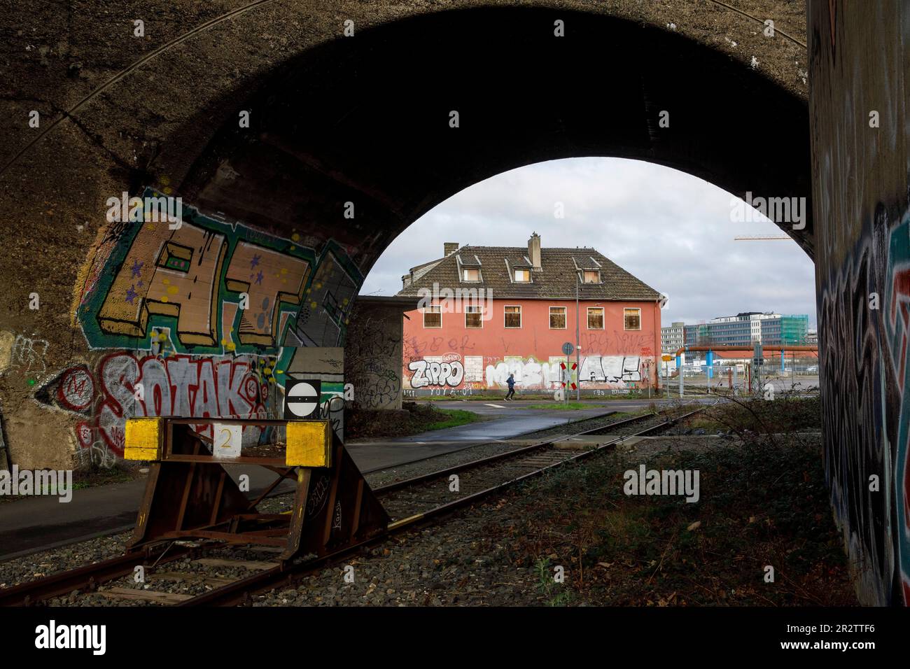 old railroad track and old abandoned harbor building in the harbour ...