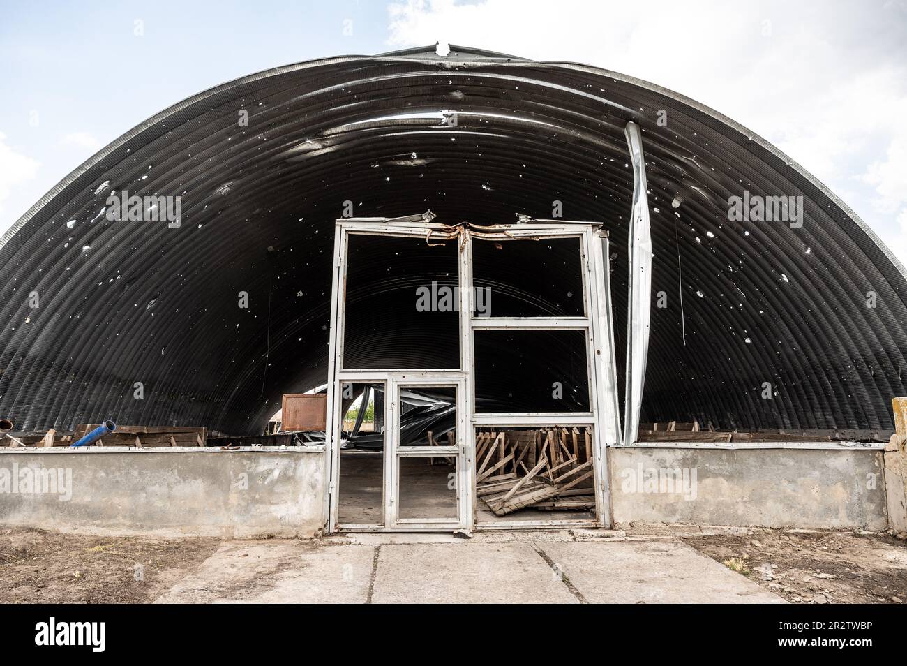 What is left of a building at a farm destroyed during the Russian ...