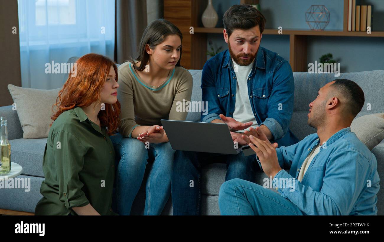 Multiracial friends working online with laptop order delivery at home ...