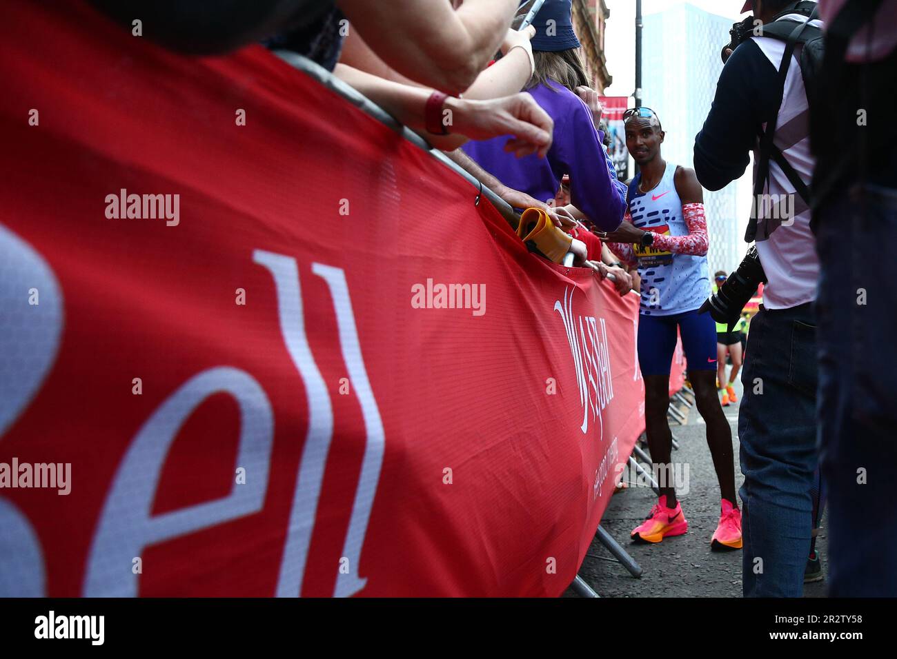 Sir Mo Farah poses with fans at the finish line of the 10k mens elite ...