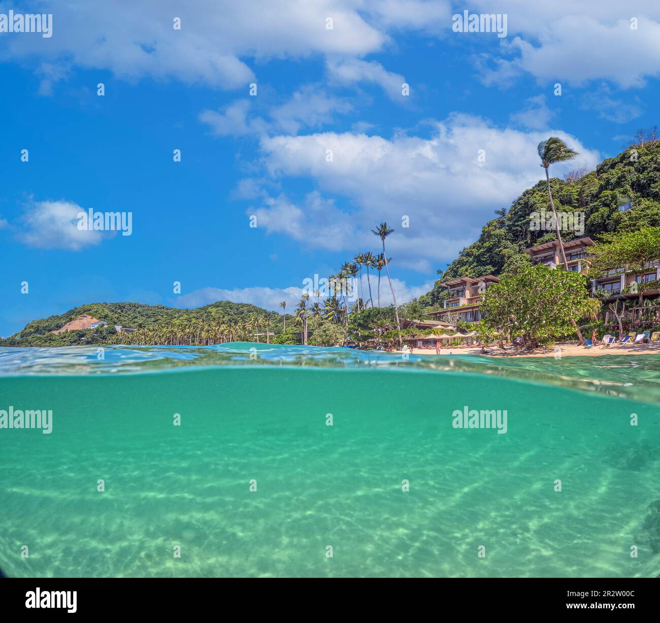 Half over half underwater shot of Maremegmeg beach near El Nido on the ...