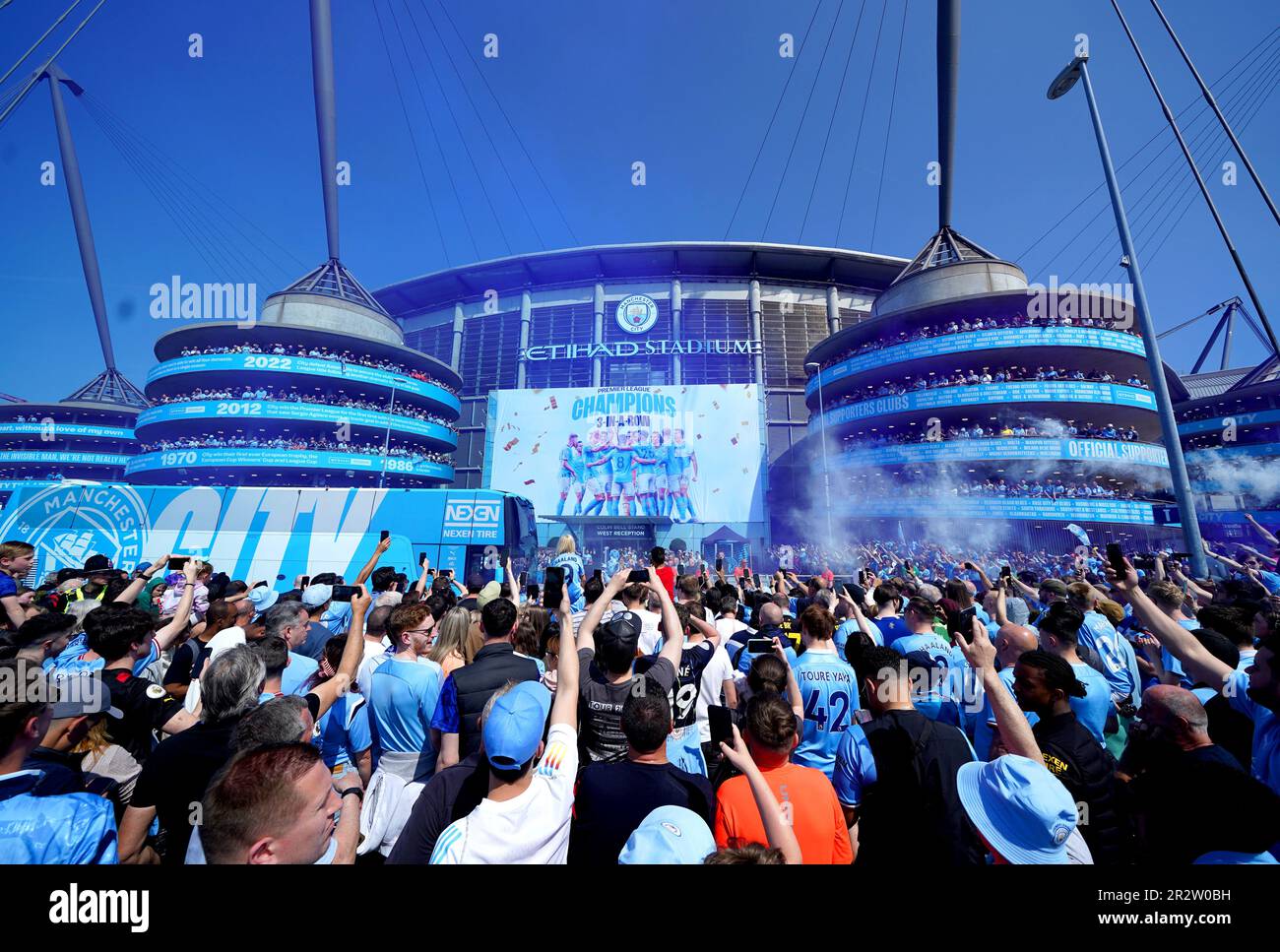 Manchester City fans celebrate as the team bus arrives ahead of the ...
