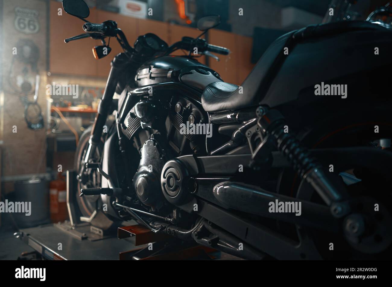Custom motorcycle in authentic creative workshop with flare light ...