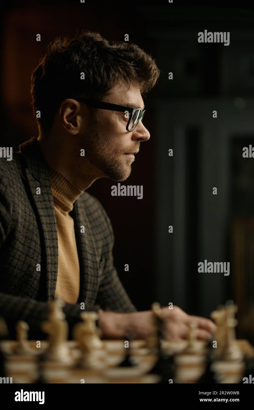 Portrait of man chess player with chessboard Stock Photo - Alamy