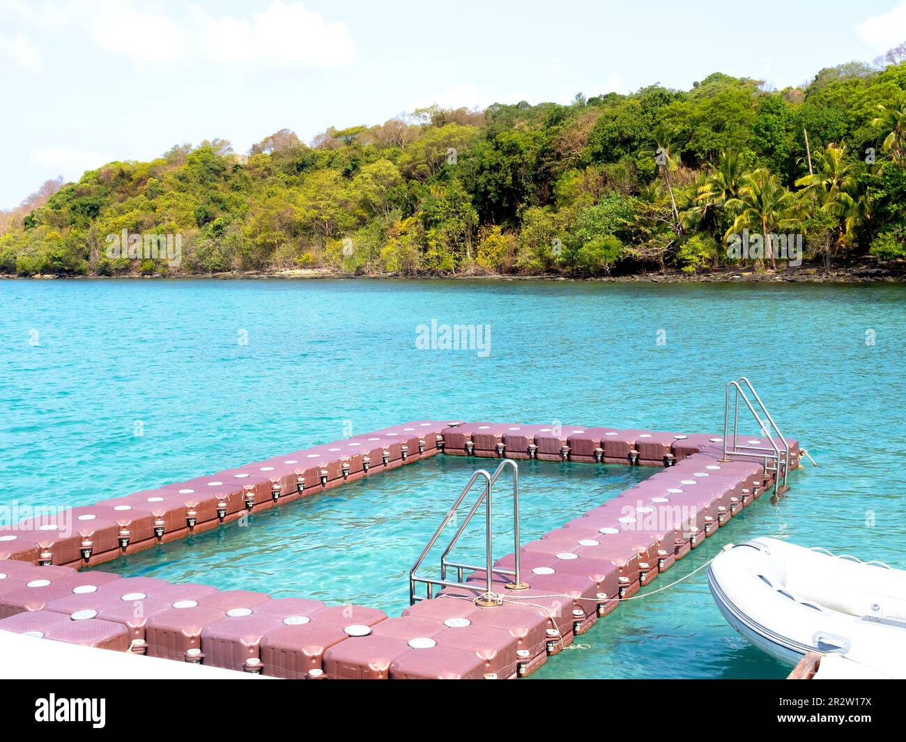 Floating swimming pool made by floating modular plastic blocks with ...