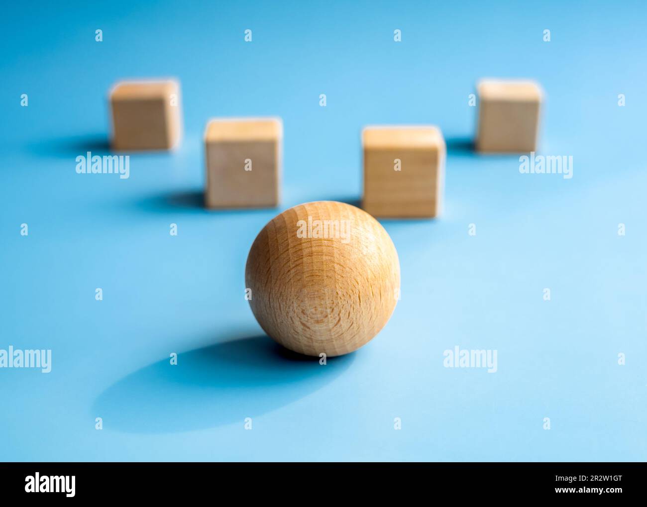 Wood sphere, different shape stand in front of the wooden cube blocks ...