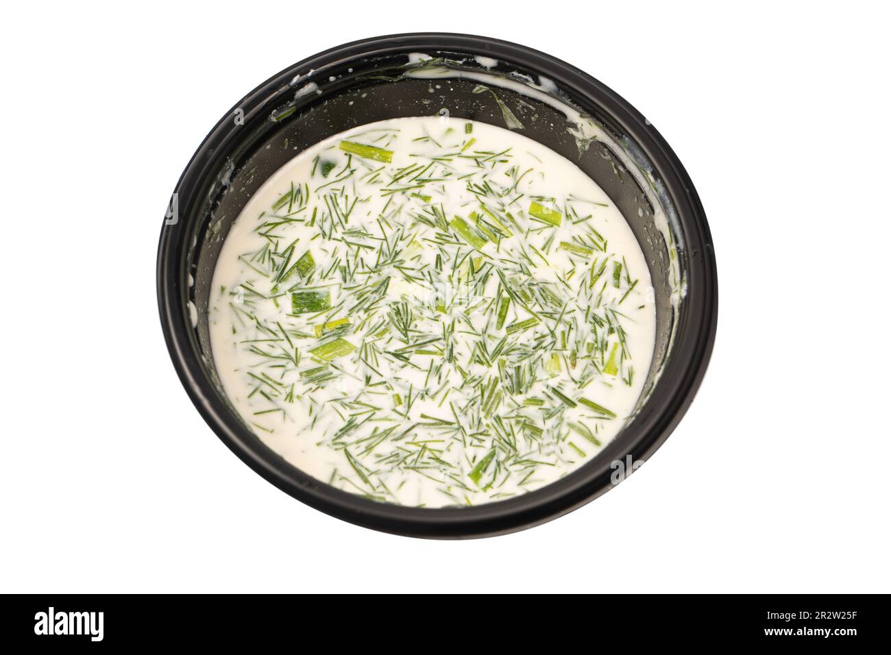 Traditional summer soup okroshka in a black plastic box isolated on a ...