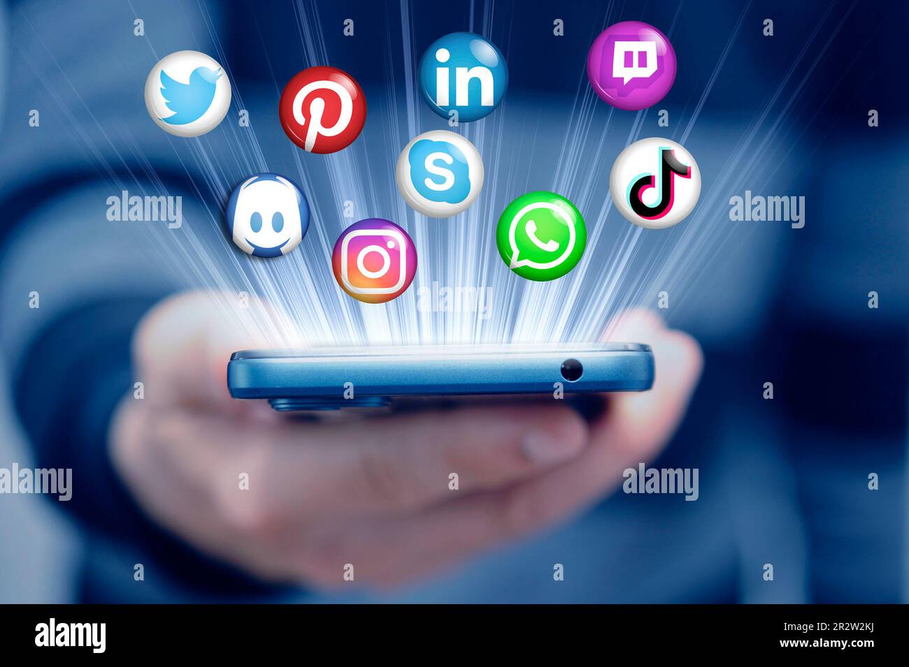 man with smartphone and social media logo over it Stock Photo - Alamy