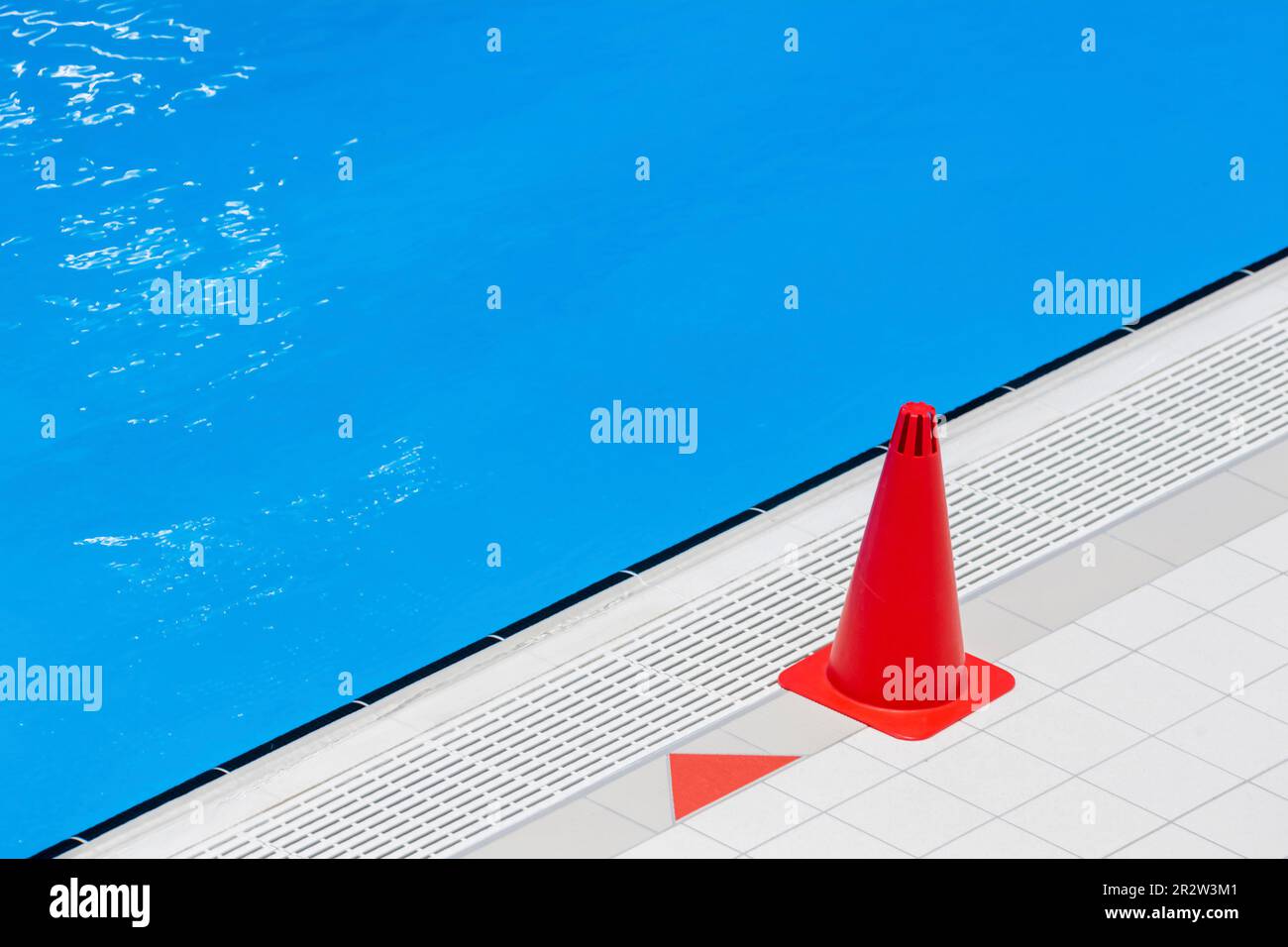 Red training cones on swimming pool floor. Trainning and camp concept ...