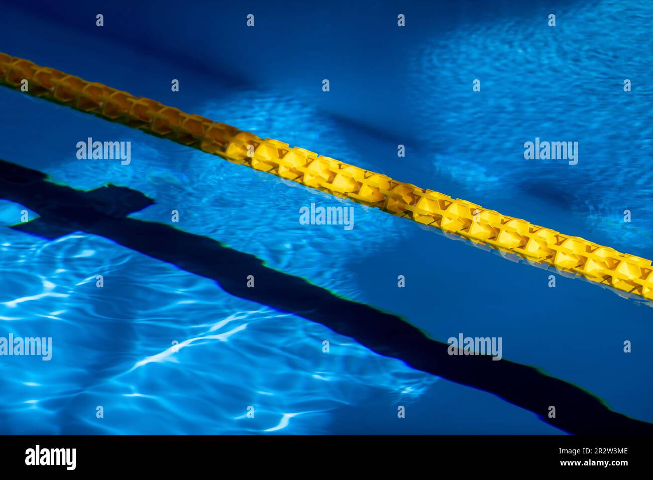 The view of an empty public swimming pool indoors. Lanes of a ...