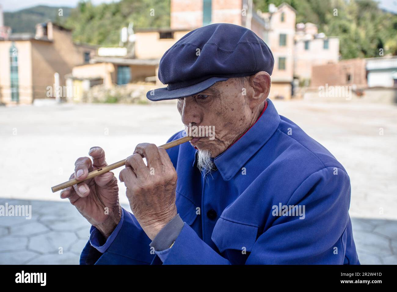 Man playing chinese flute hi-res stock photography and images - Alamy