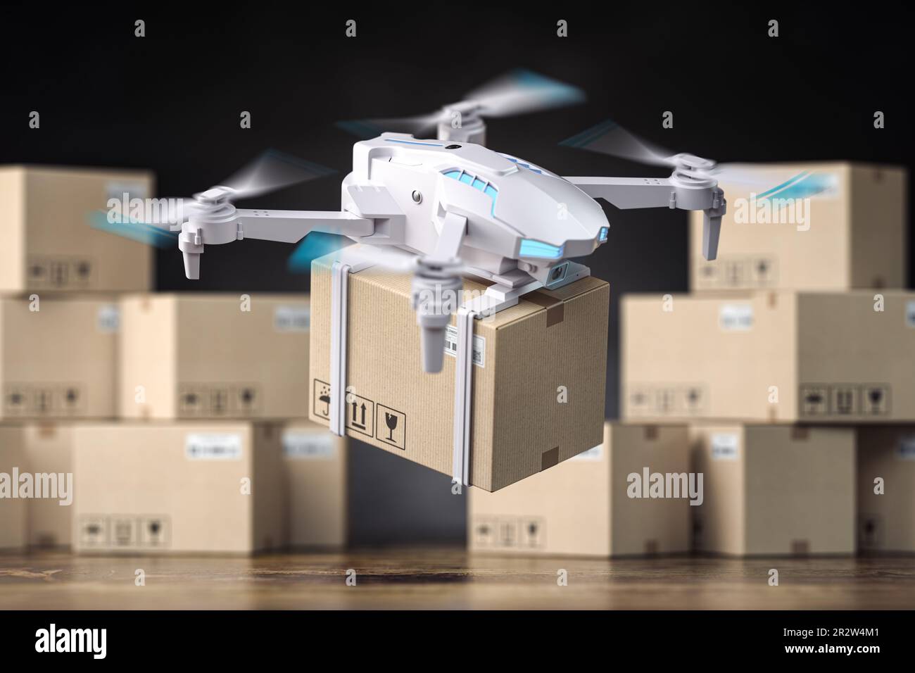 Drone or quadcopter and cardboard box, in a warehouse with parcels ...