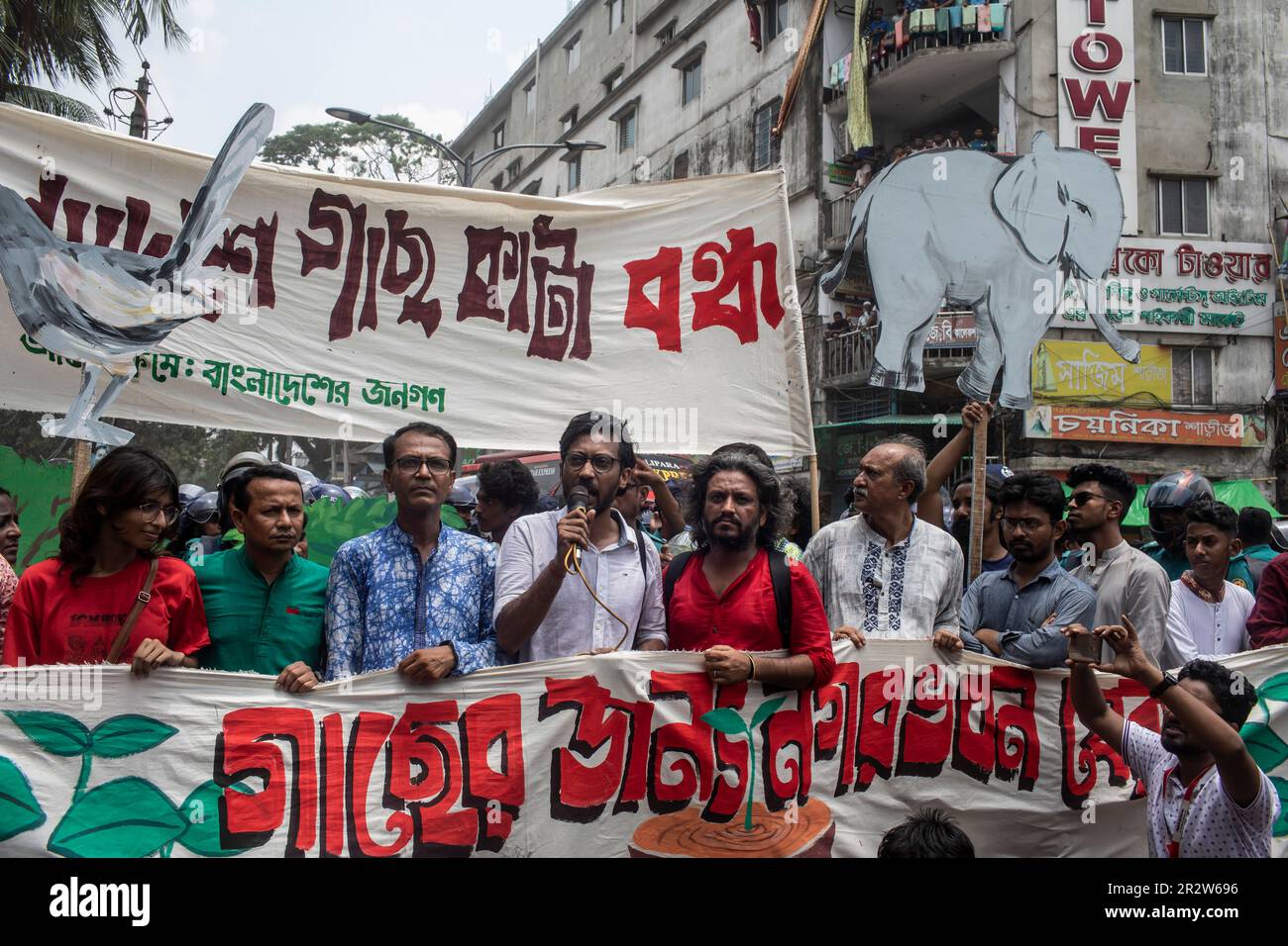 Dhaka, Bangladesh. 21st May, 2023. Protesters hold a banner and ...