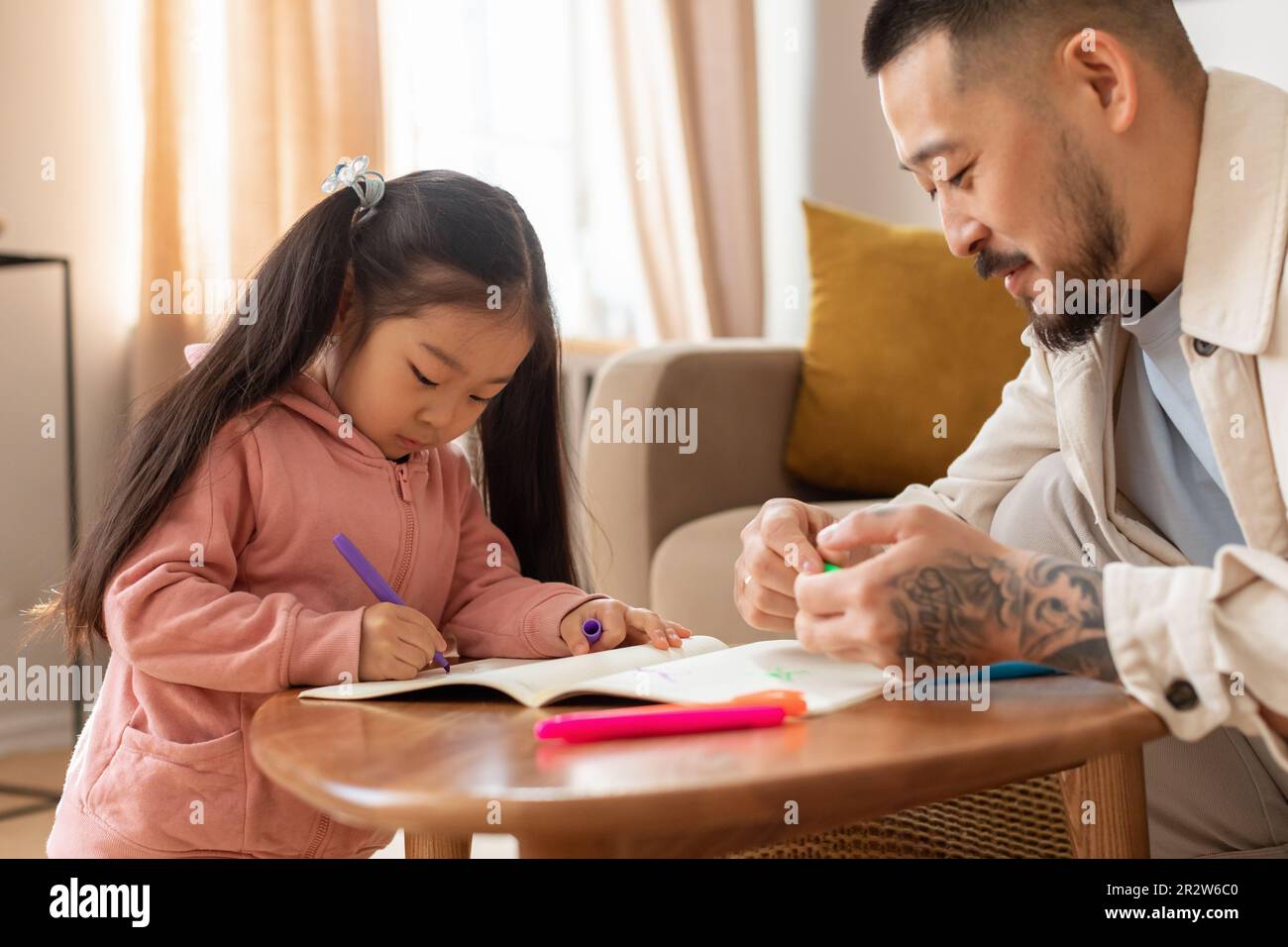 Asian Dad Teaching Baby Daughter To Write Playing At Home Stock Photo ...