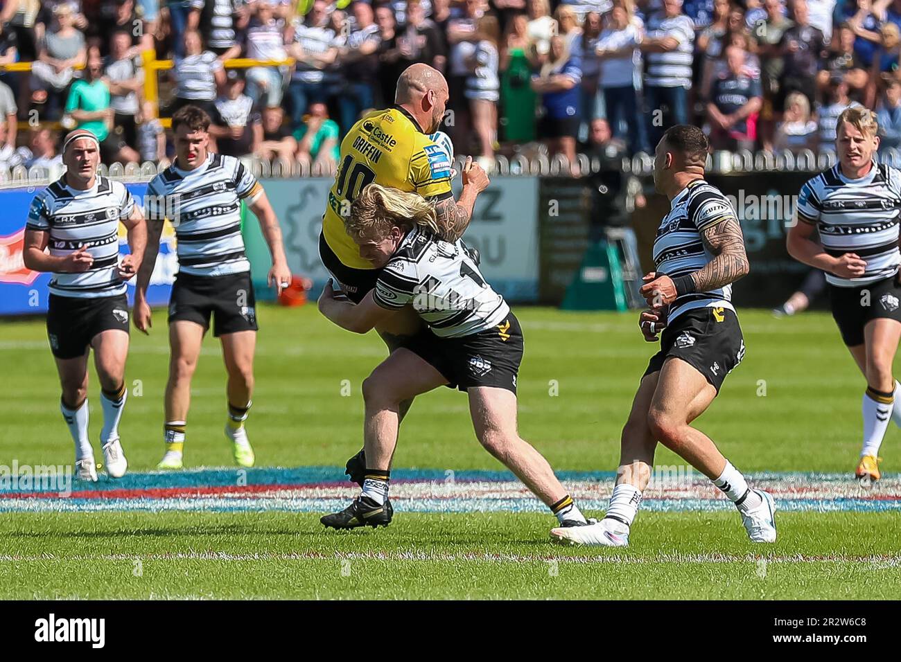 Castleford, UK. 21st May, 2023. George Griffin is tackled in the air by Brad Fash of Hull ...