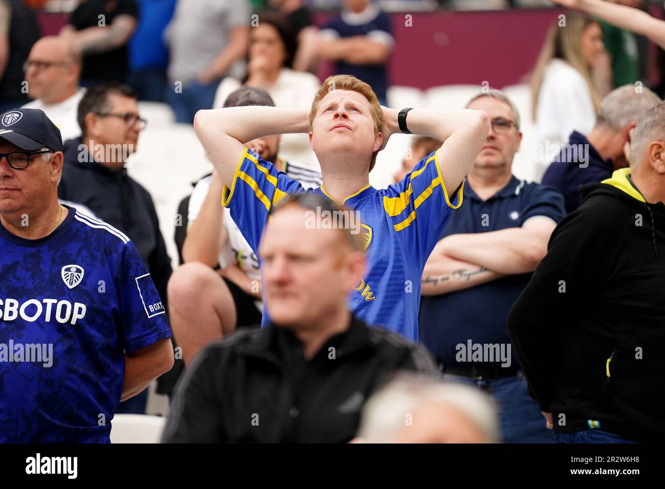 Leeds United fans appear dejected in the stands after the Premier ...