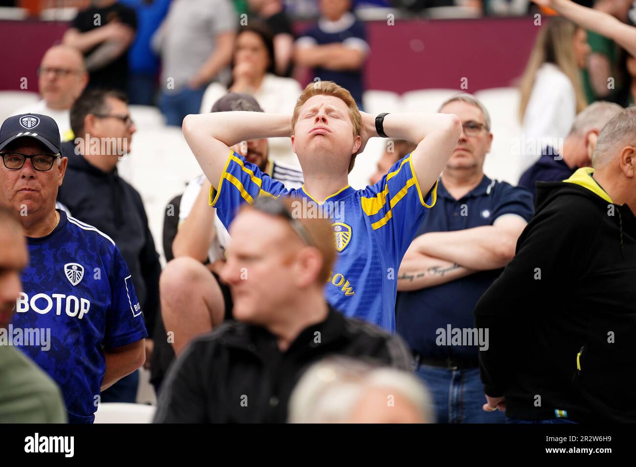 Leeds United fans appear dejected in the stands after the Premier ...
