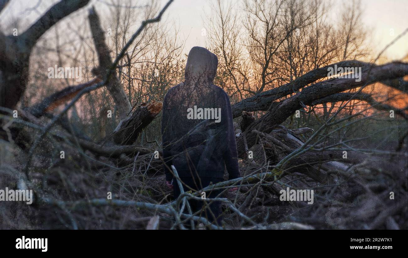 A spooky, transparent ghost figure watching the sunset. On an eerie ...