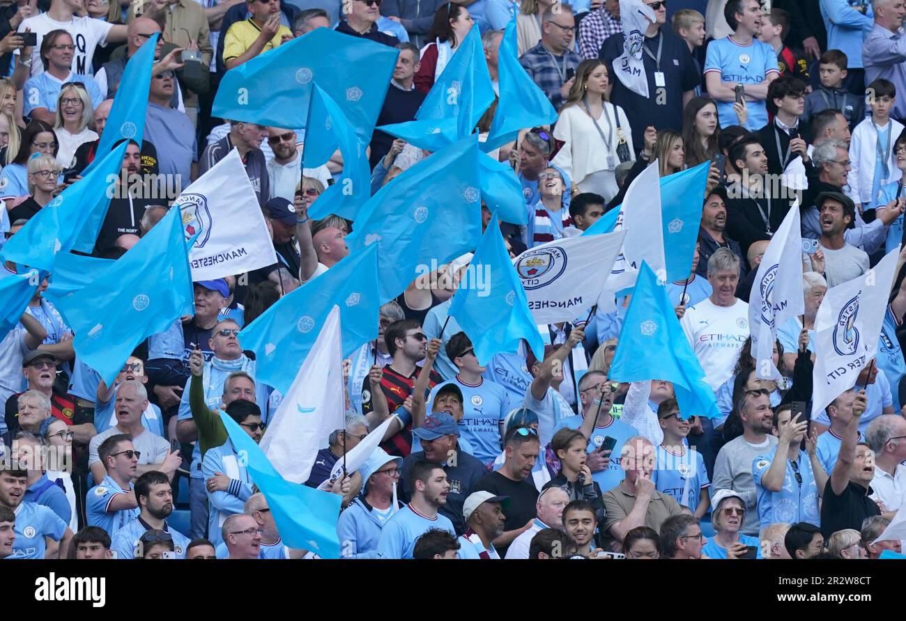 Manchester, UK. 21st May, 2023. Manchester City fans wave flags during ...