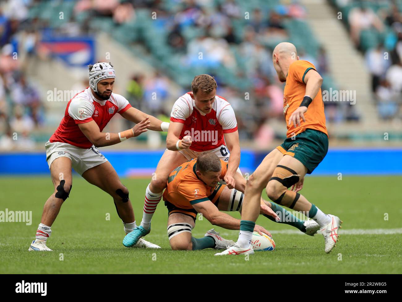 Australia’s Nick Malouf is tackled by Great Britain’s Paddy Kelly ...