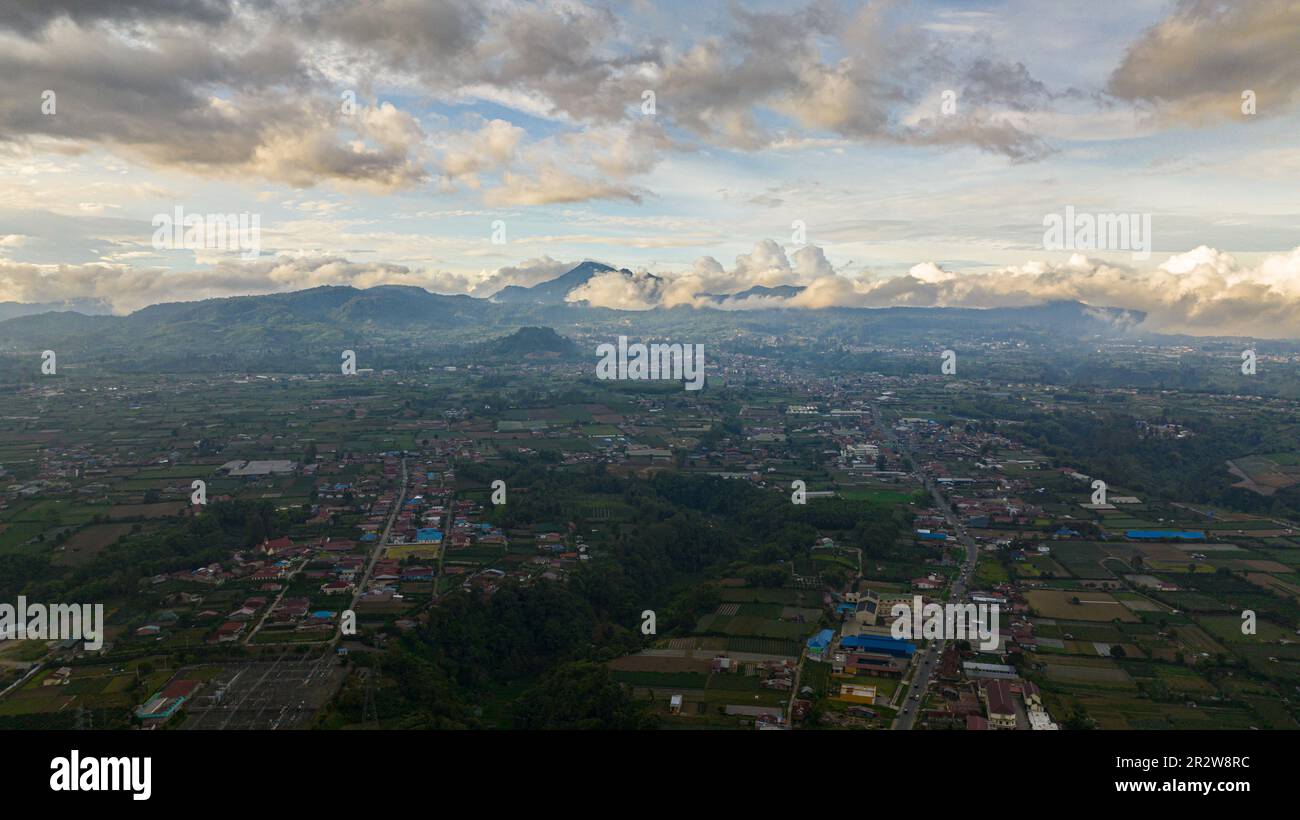 Aerial view of farmland in the countryside in the tropics. Agricultural ...