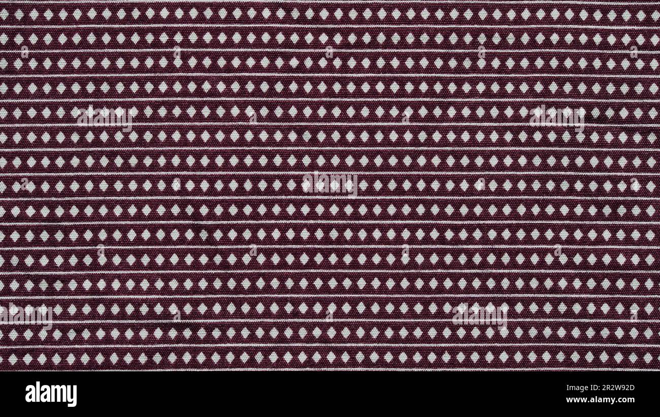 detail of wine red and white rhombus and stripes fabric pattern ...