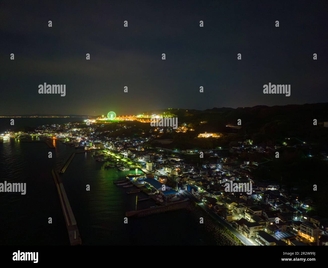 Quiet coastal town of Iwaya on Awaji Island at night with lights from ...