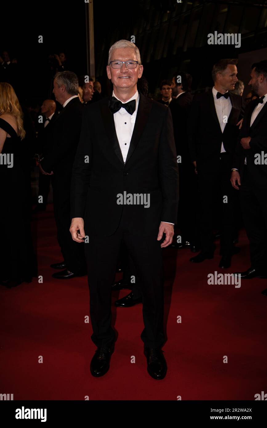 Tim Cook poses for photographers upon departure from the premiere of ...