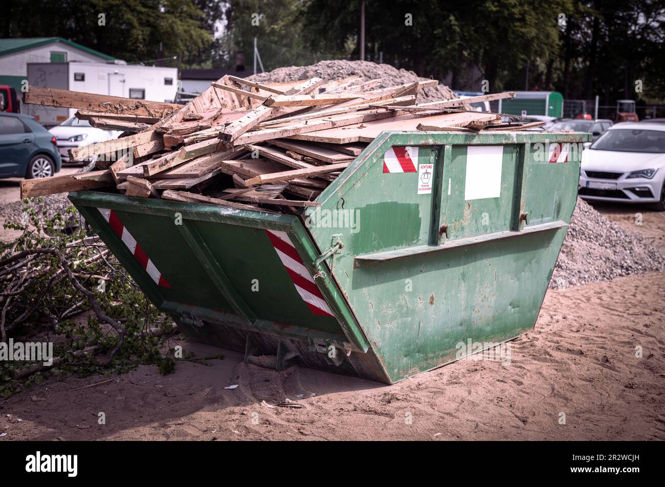 many wood waste is collected on a construction site in a green waste ...