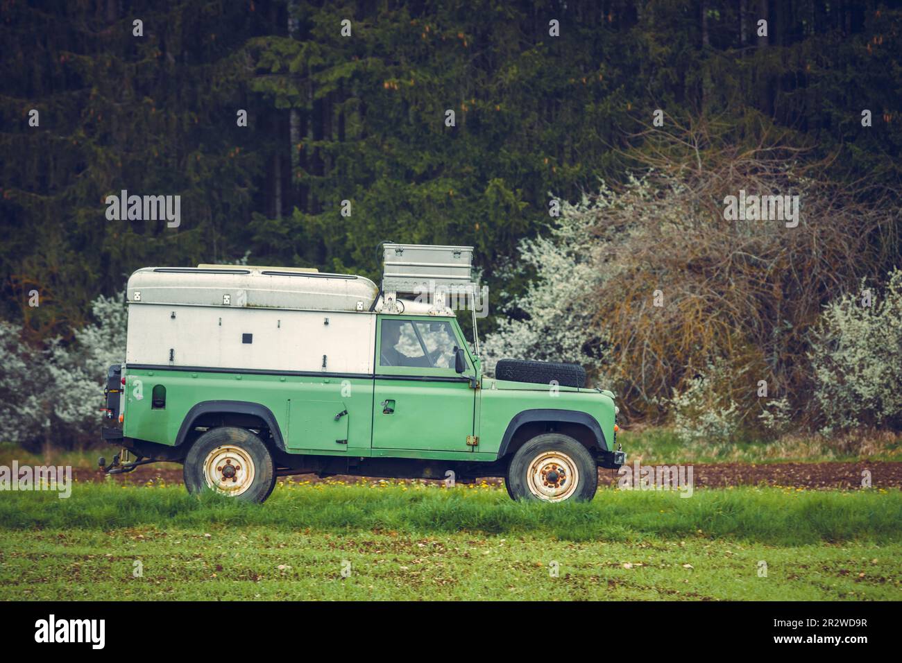 Land Rover Defender British oldtimer vintage off-road utility car on a ...
