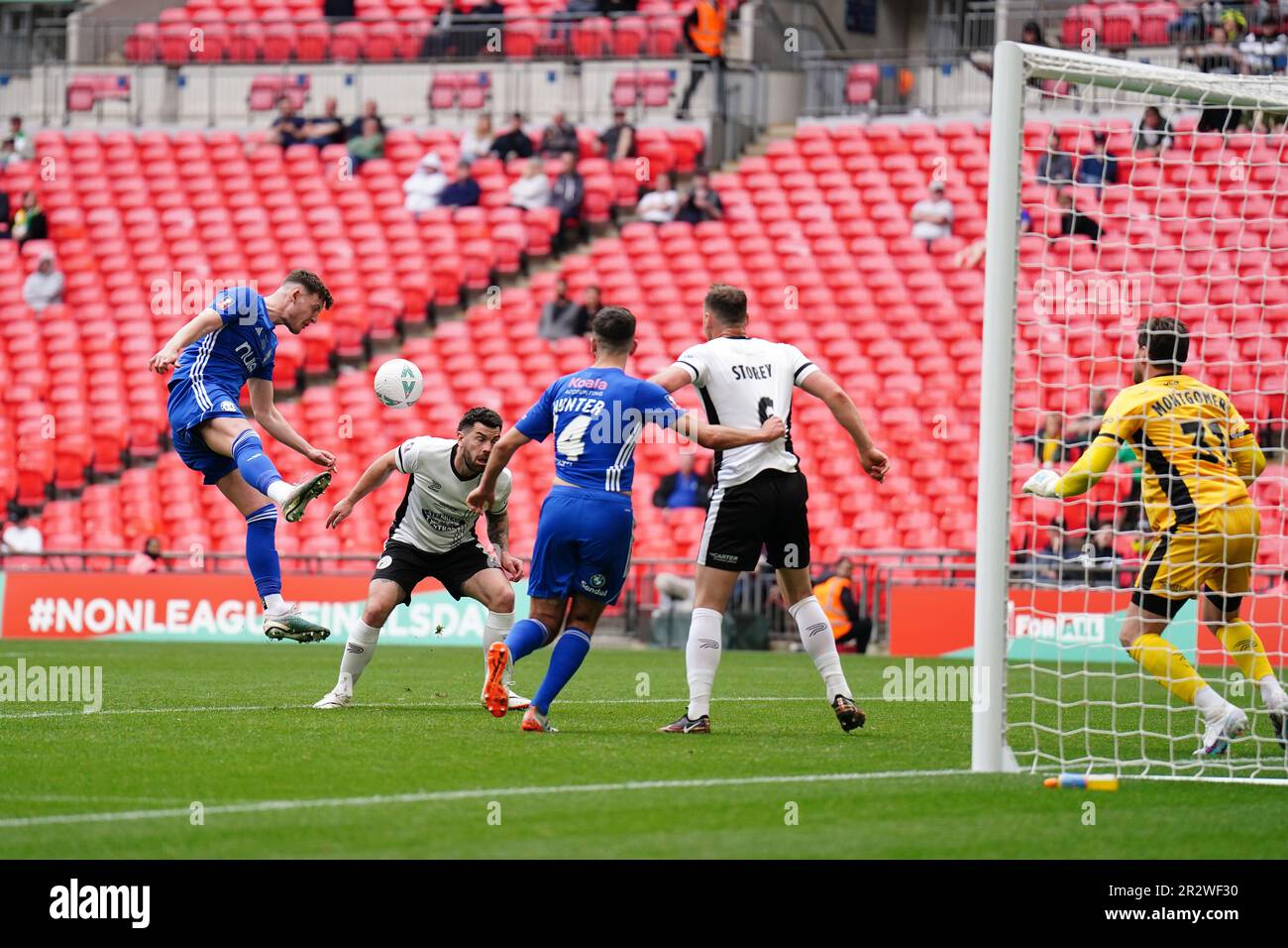 FC Halifax Town’s Jamie Cooke (left) heads towards goal during the ...