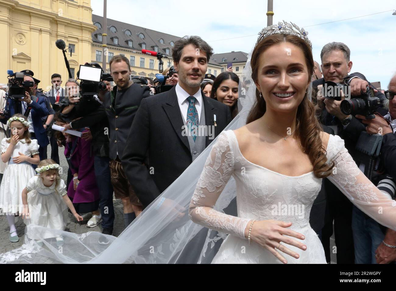 MUNICH, Germany - 20. MAY 2023: the bride and groom leave the wedding ...